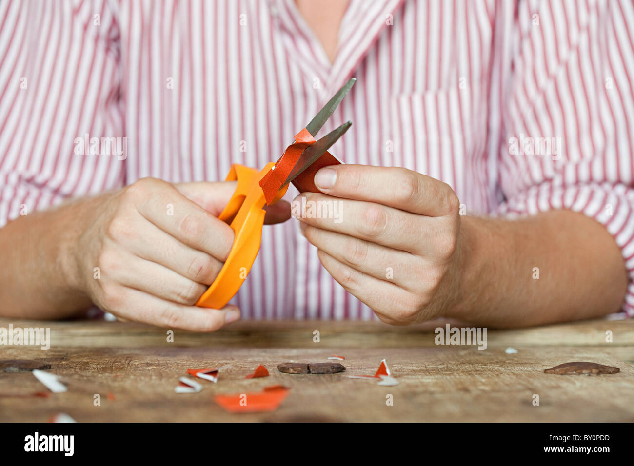 Person cutting paper Stock Photo - Alamy