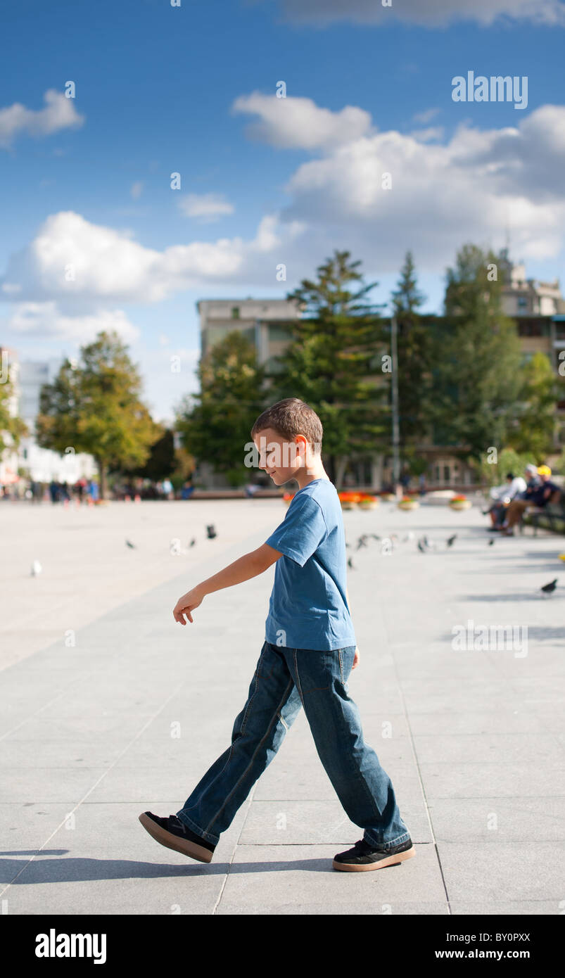 Portrait of a boy walking in the park Stock Photo - Alamy