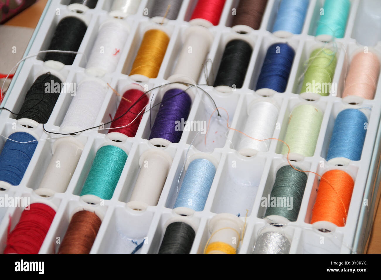 many colorful spools of thread Stock Photo - Alamy