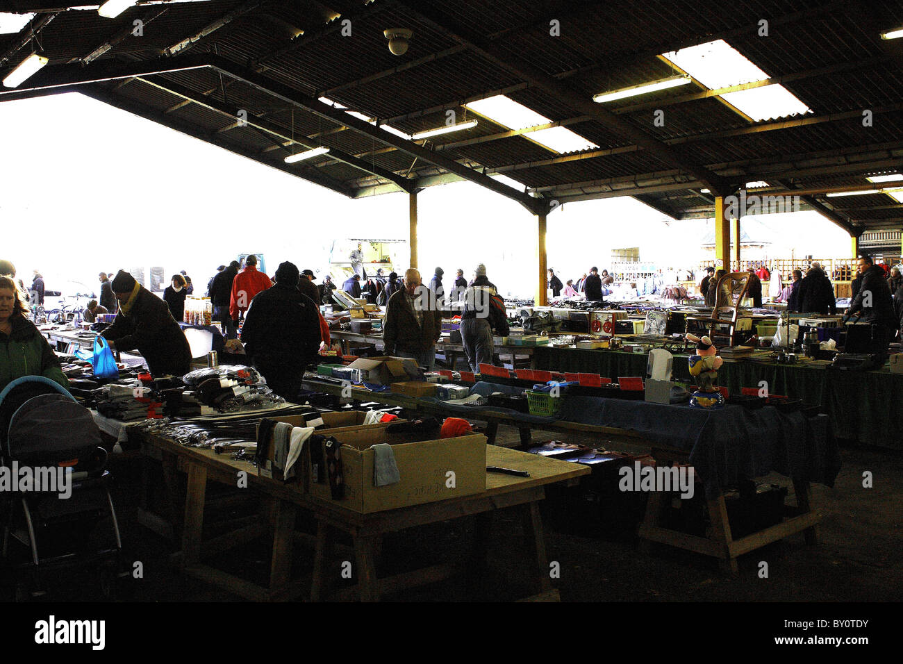 A table top and stalls car boot sale with house clearance goods, used ...