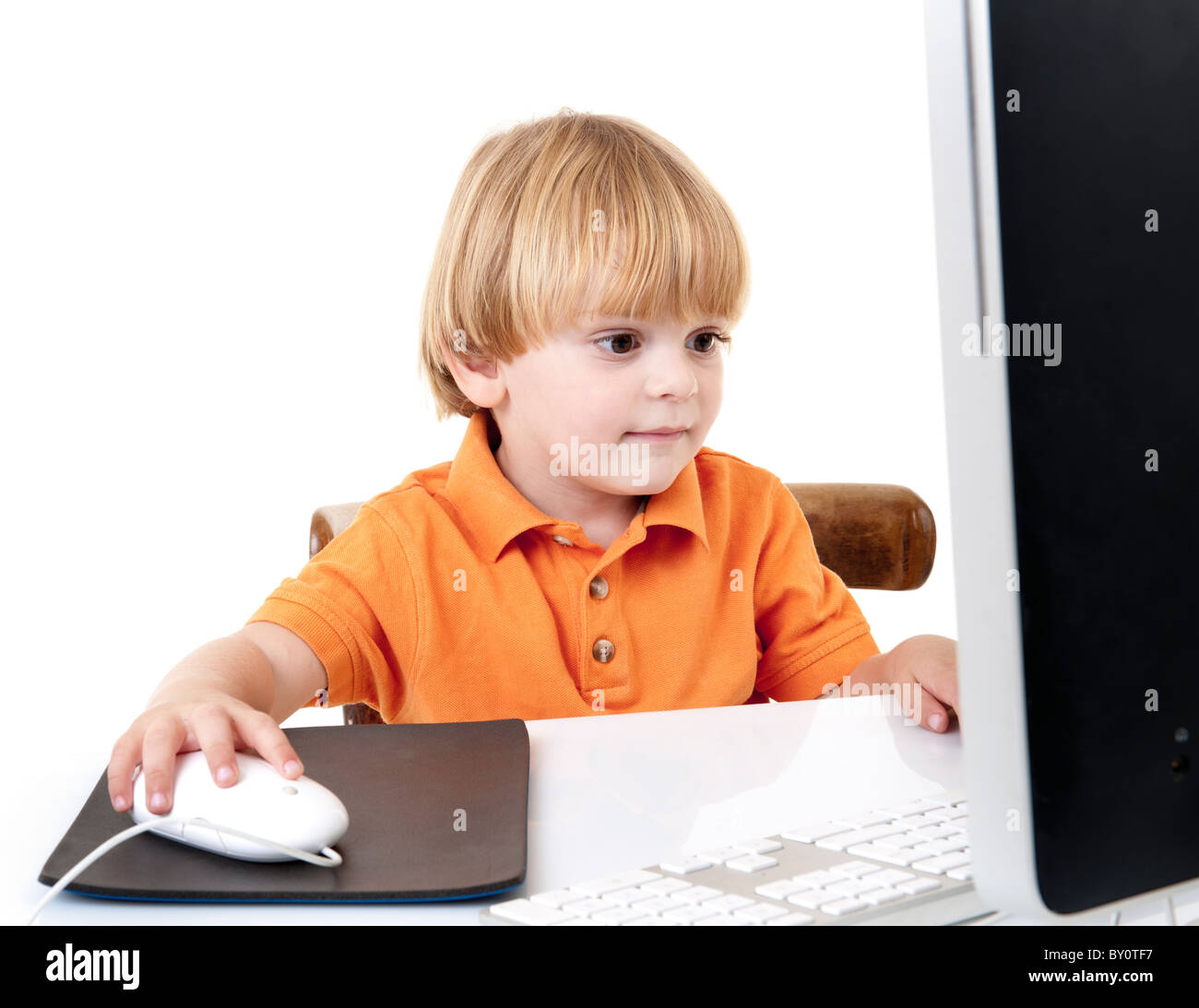 young boy with desktop computer isolated on white Stock Photo - Alamy