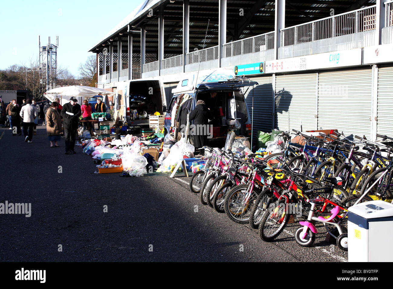 A table top and stalls car boot sale with house clearance goods, used ...