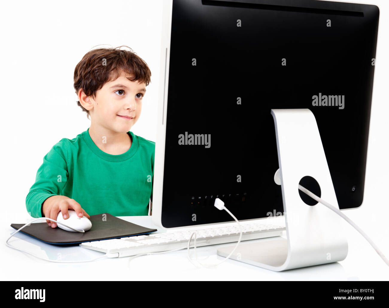 young boy with desktop computer isolated on white Stock Photo - Alamy