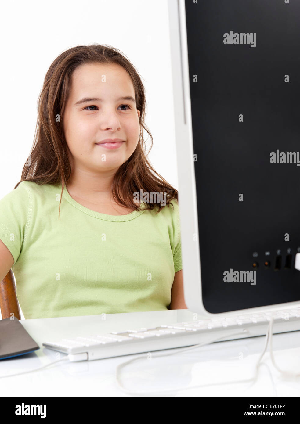 Young girl looking at computer screen isolated on white Stock Photo - Alamy