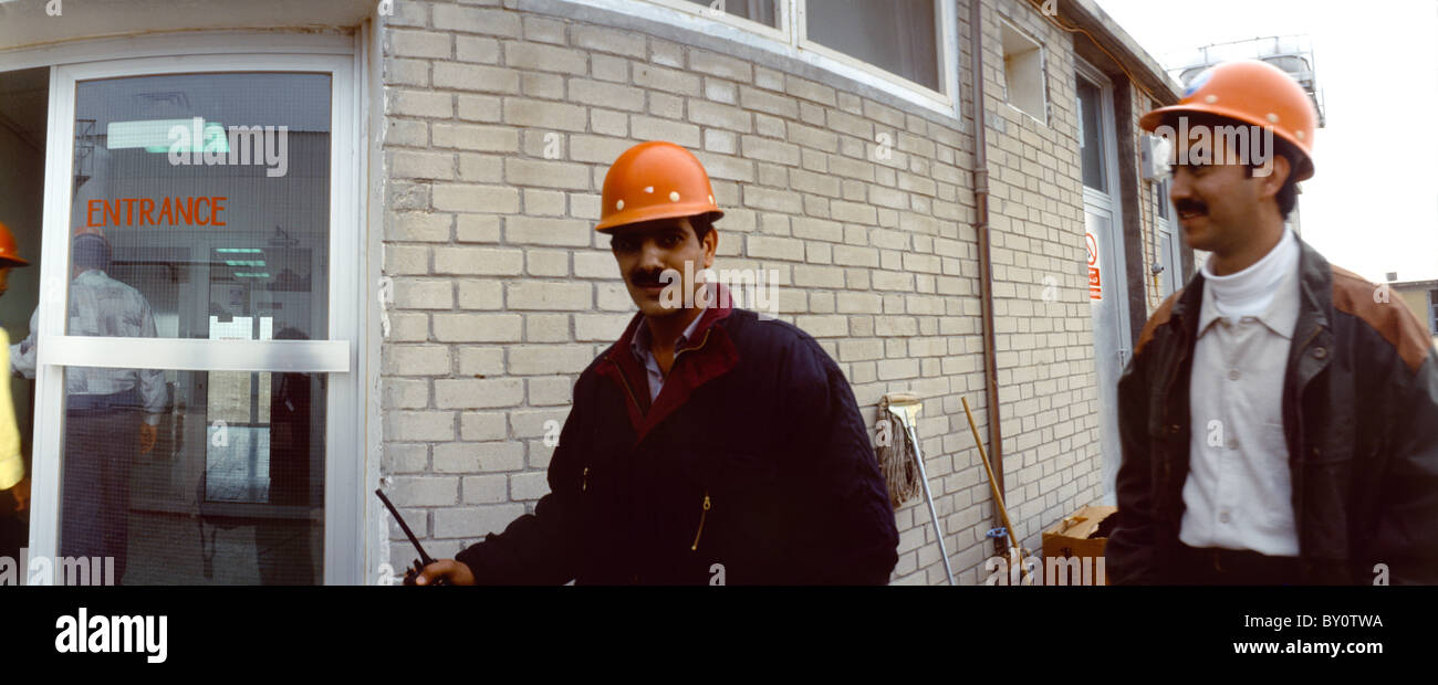 Kuwait Burgan Oil Field Men In Hard Hats At Entrance To Refinery Stock ...