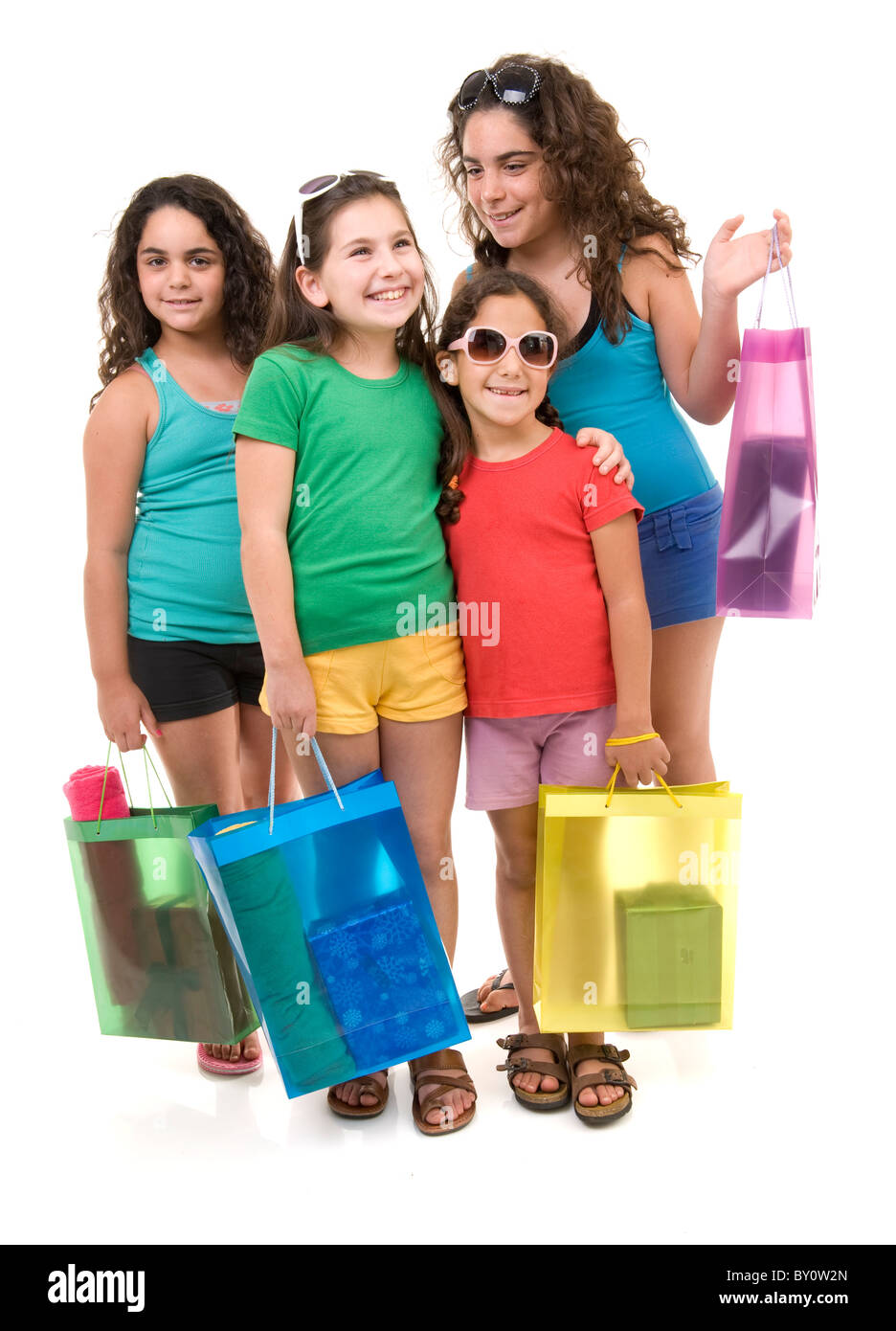 four young girls with shopping bags isolated on white Stock Photo - Alamy