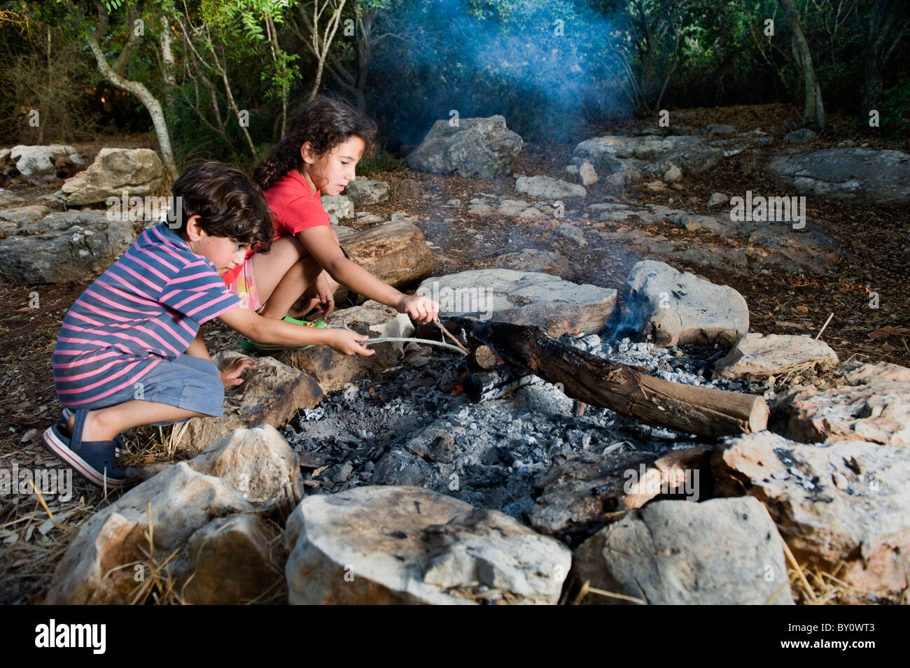 kids in a campfire in a mediterranean forest Stock Photo - Alamy