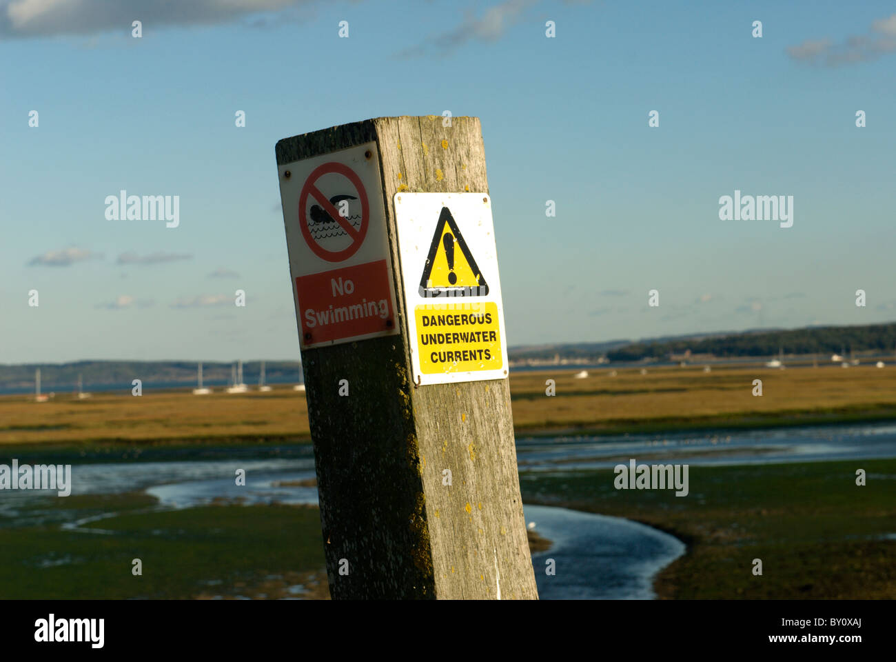 No Swimming and dangerous deep water currents warning signs beside the ...