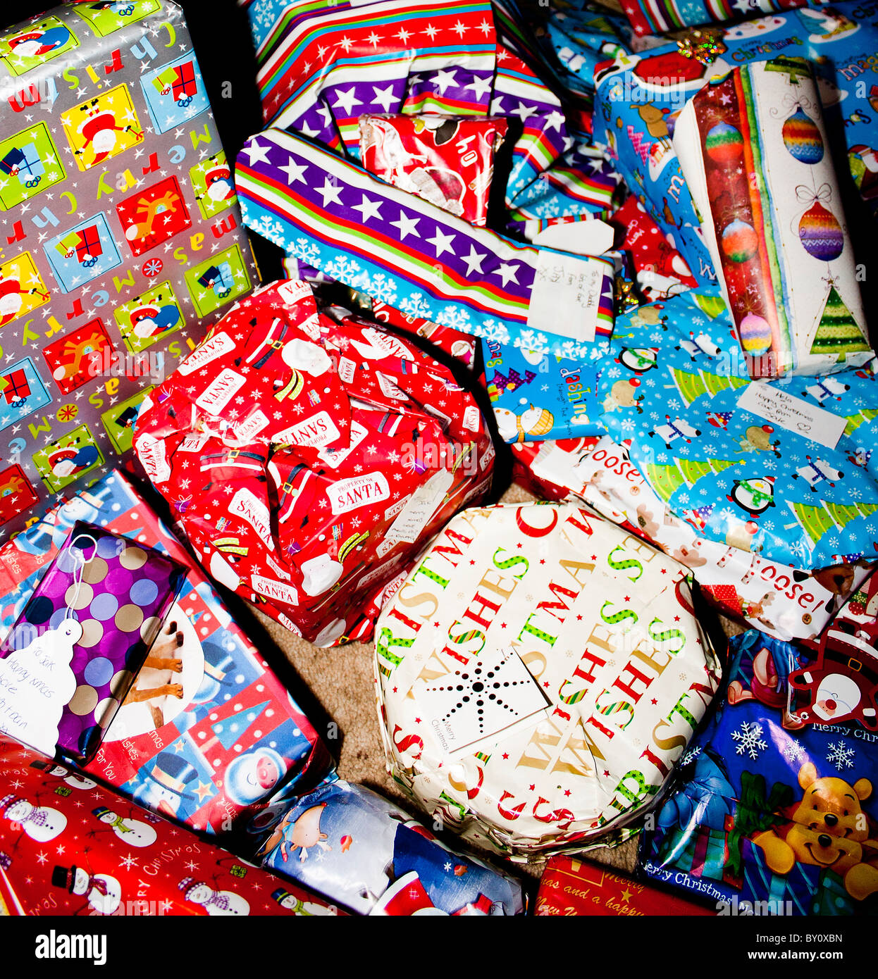 A large selection of colourful individually wrapped Christmas presents ...
