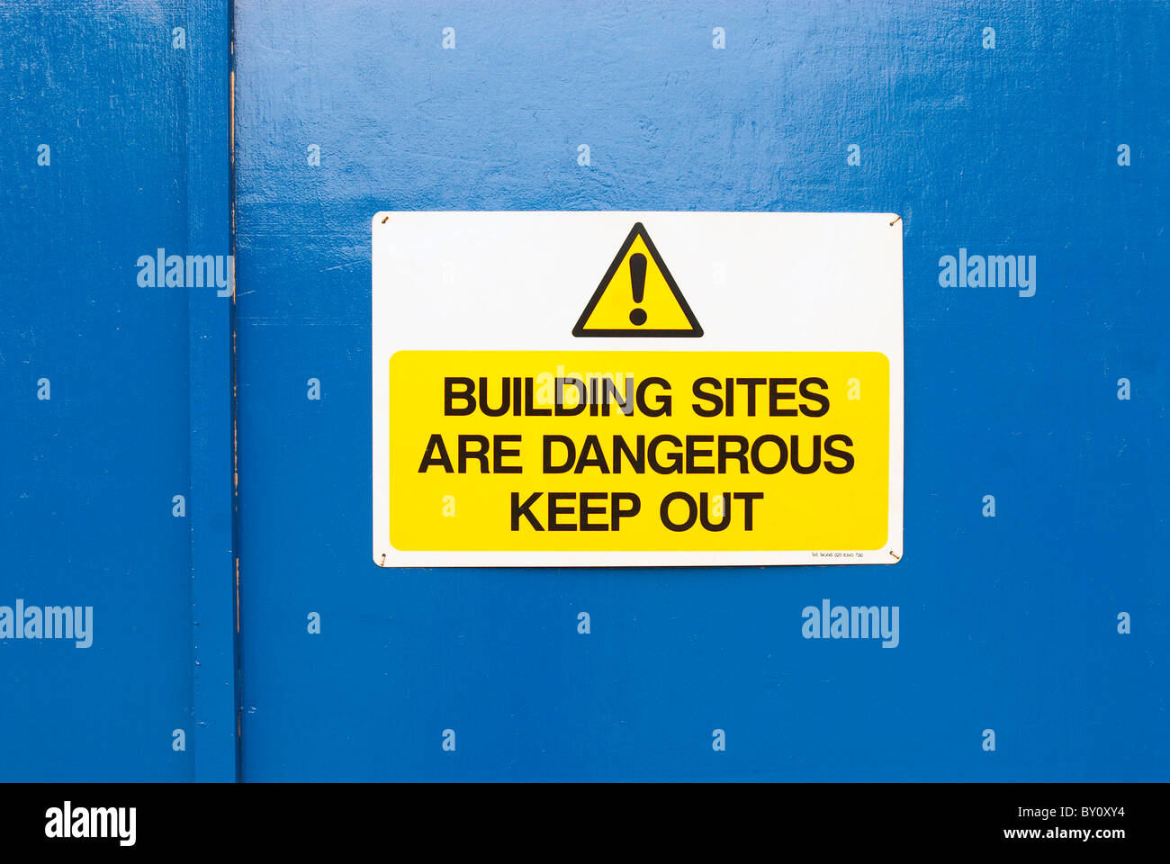 Hoarding with keep out warning sign Stock Photo - Alamy