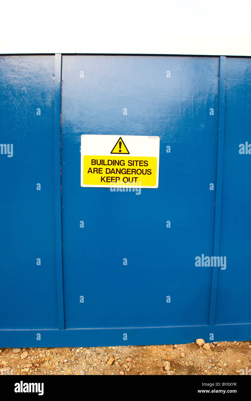 Hoarding with keep out warning sign Stock Photo - Alamy