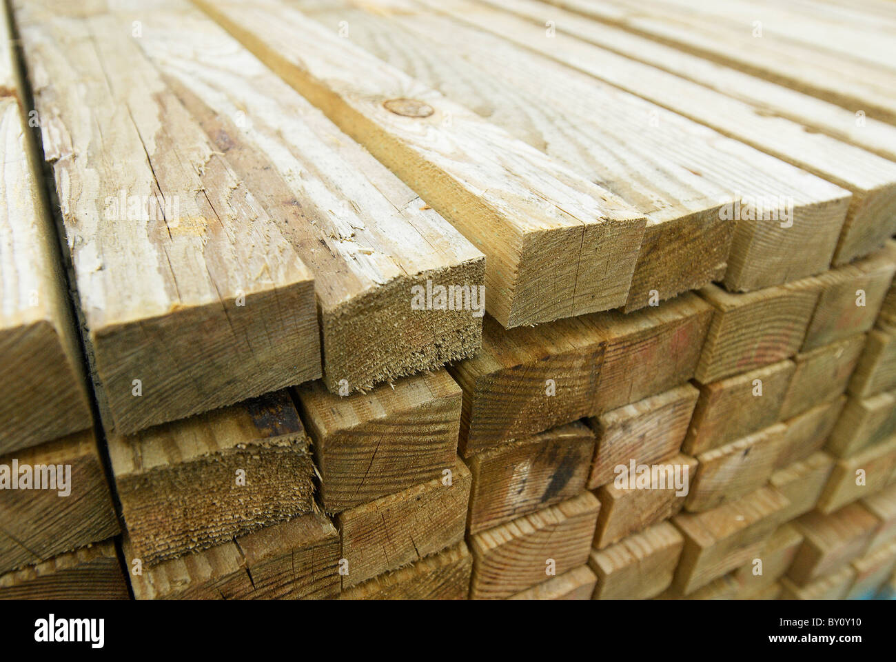 Stacked wood in timber's merchant warehouse Stock Photo - Alamy