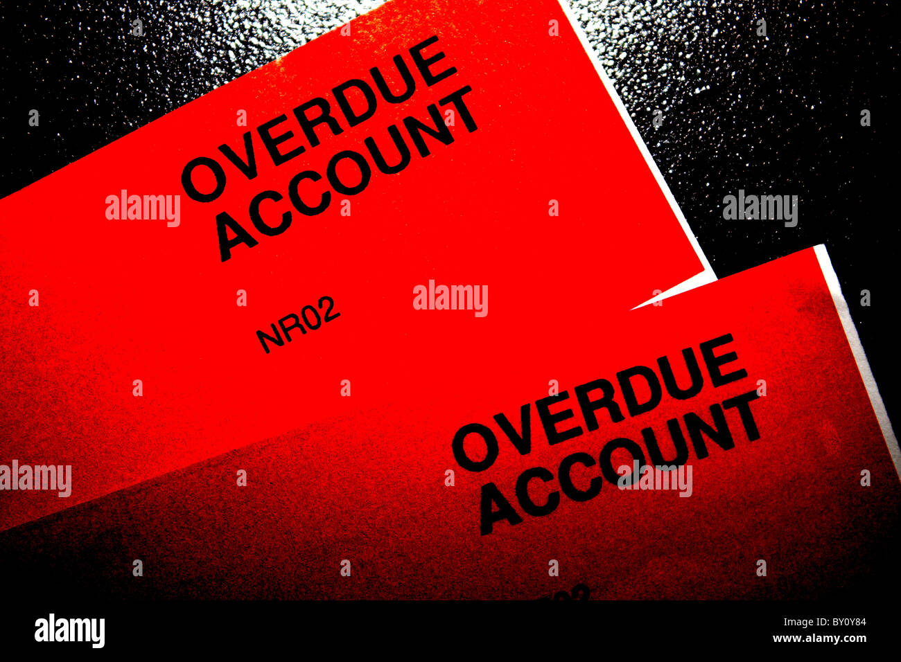 A red bill showing an overdue account in debt and in urgent need of ...