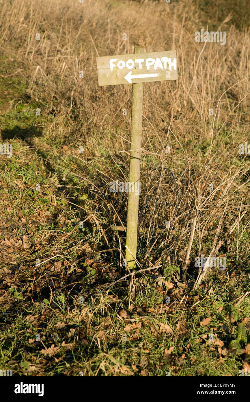Wooden sign footpath painted sign direction arrow Stock Photo - Alamy