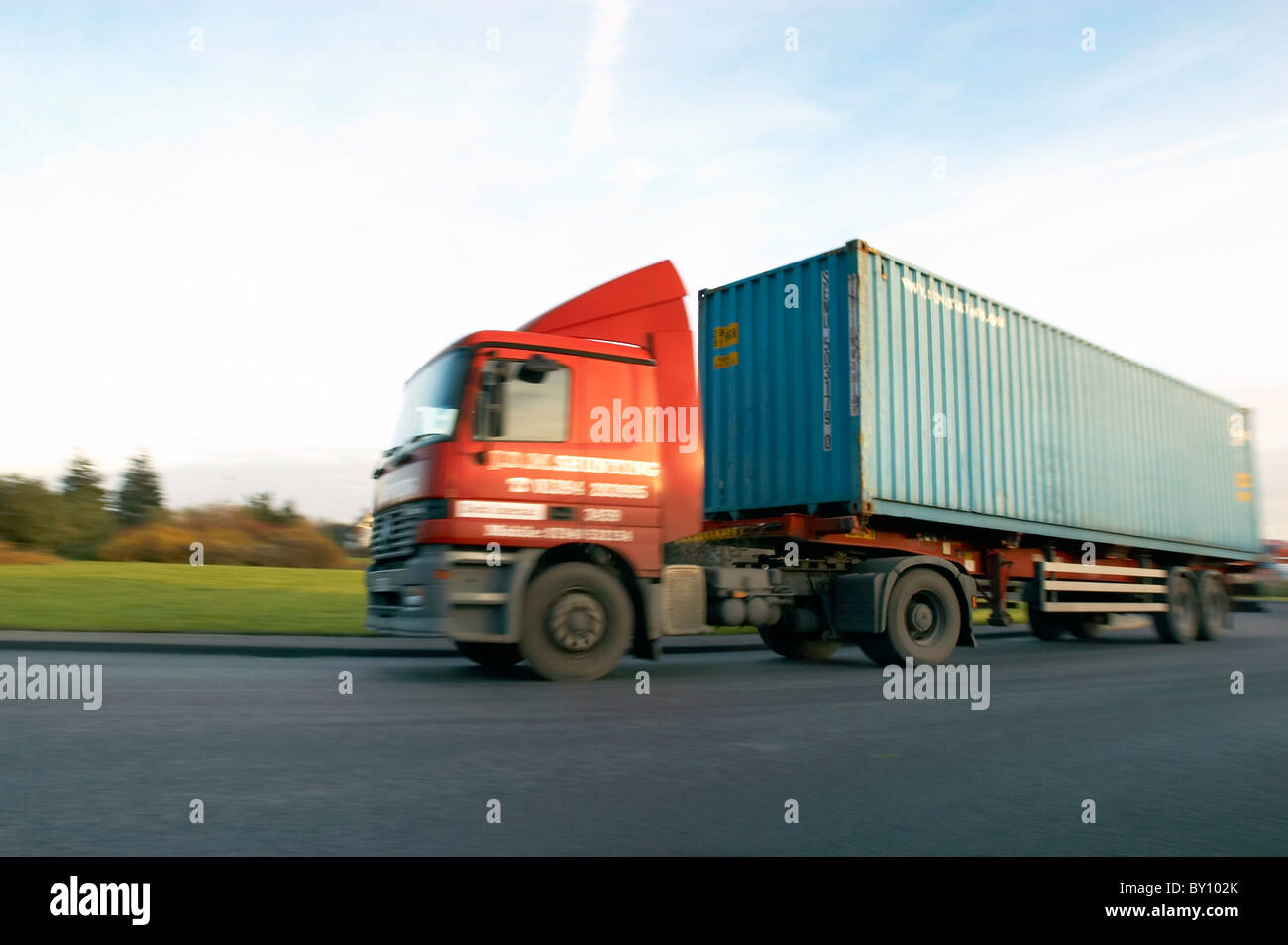 Articulated container truck on the road Stock Photo - Alamy