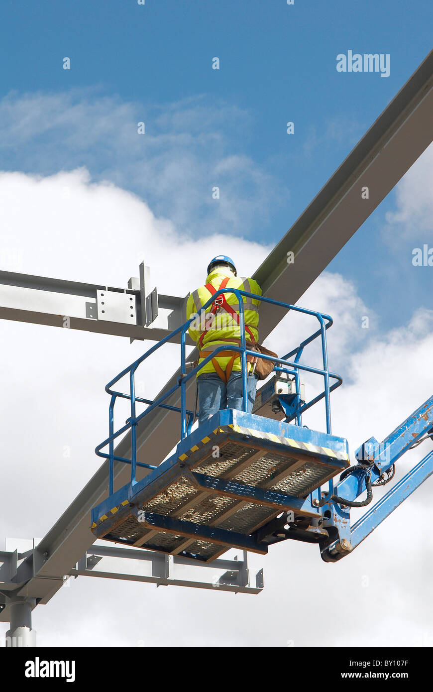 Construction worker inspecting steel beams on a platform Stock Photo ...