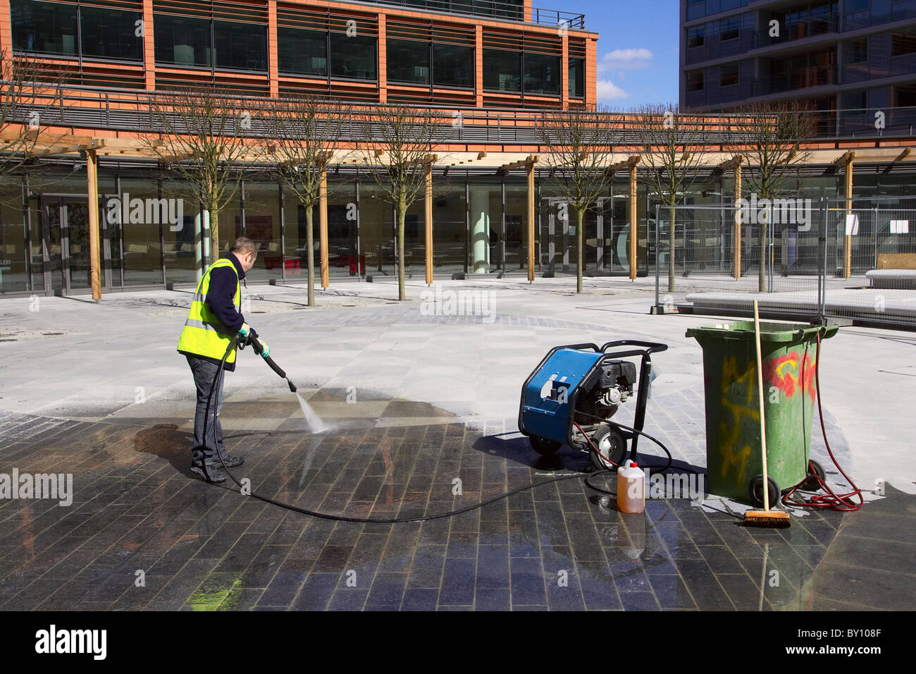 Worker cleaning pavement high pressure hi-res stock photography and ...