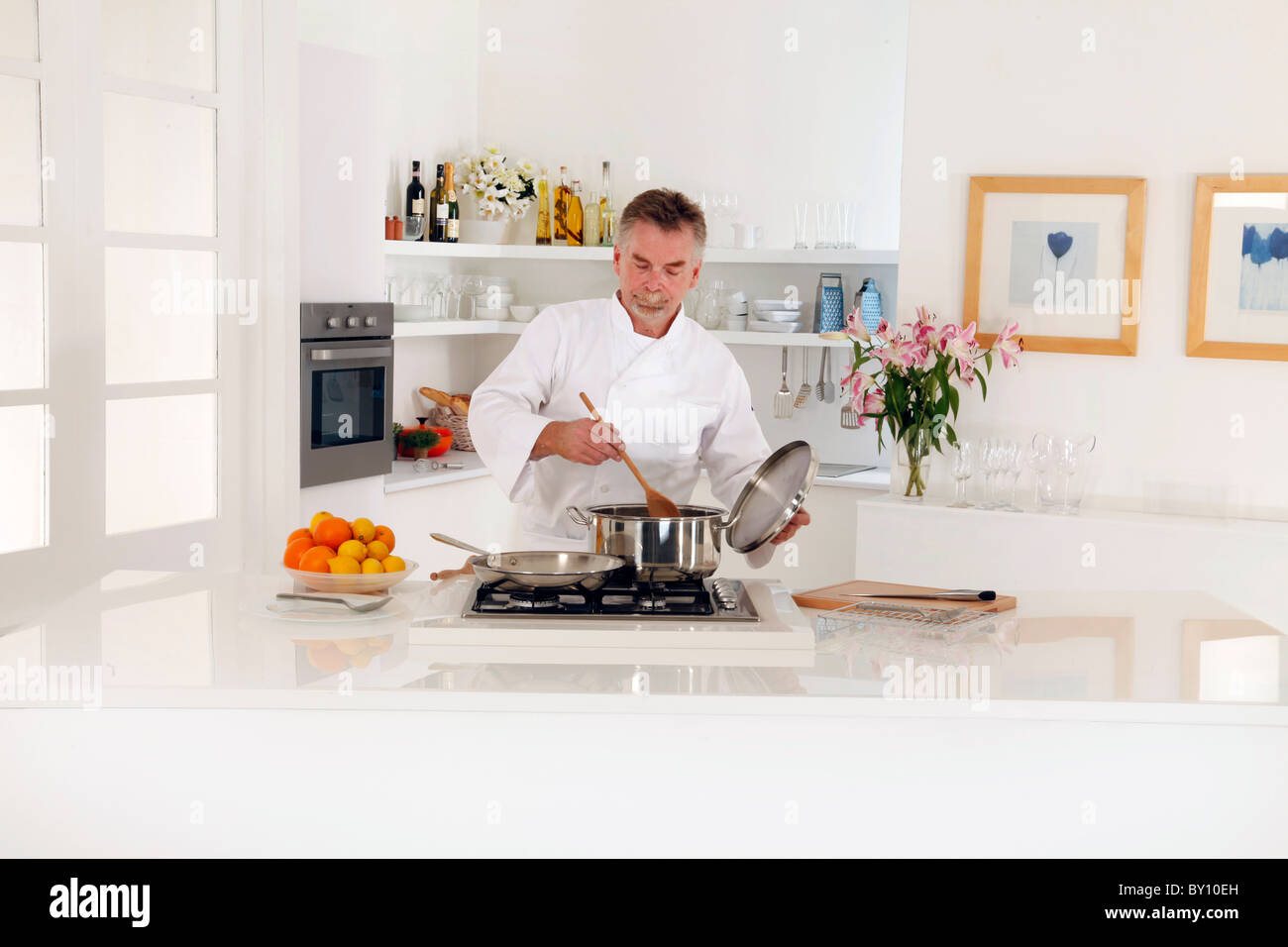 CHEF COOKING IN KITCHEN Stock Photo - Alamy