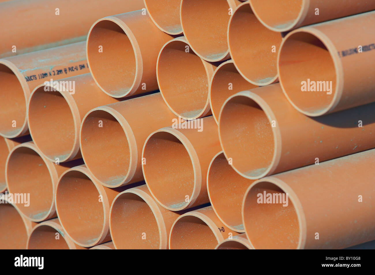 Stack of pipes on a building merchant yard Stock Photo - Alamy