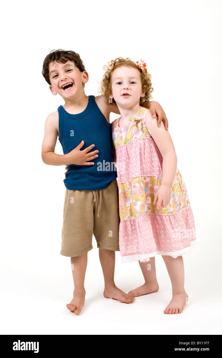 young boy and girl couple isolated on white Stock Photo - Alamy