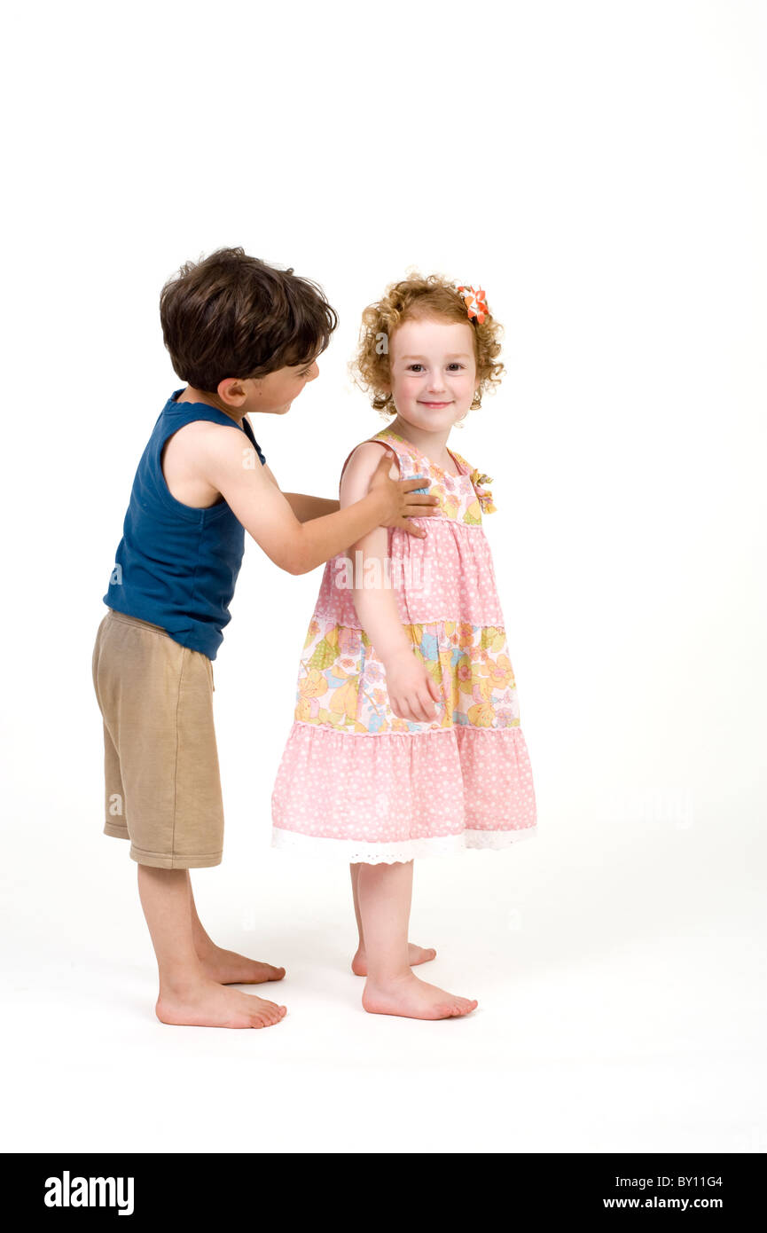 young boy and girl couple isolated on white Stock Photo - Alamy