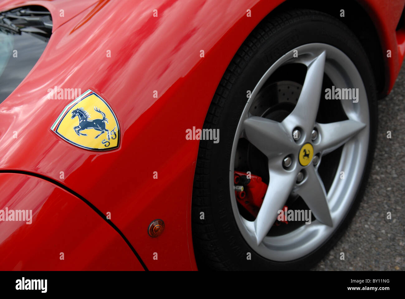 A Red Ferrari detail including logo Stock Photo - Alamy