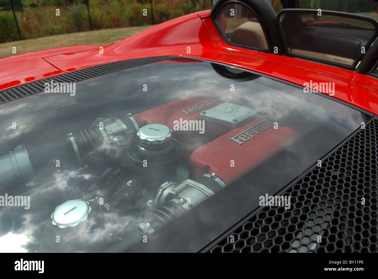 A Red Ferrari detail including logo Stock Photo - Alamy
