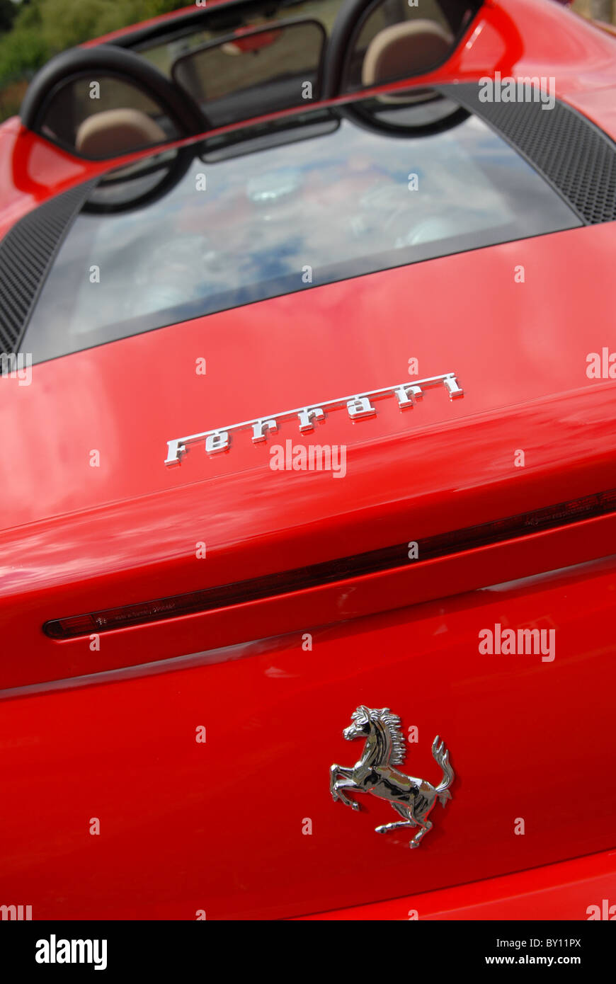 A Red Ferrari detail including logo Stock Photo - Alamy