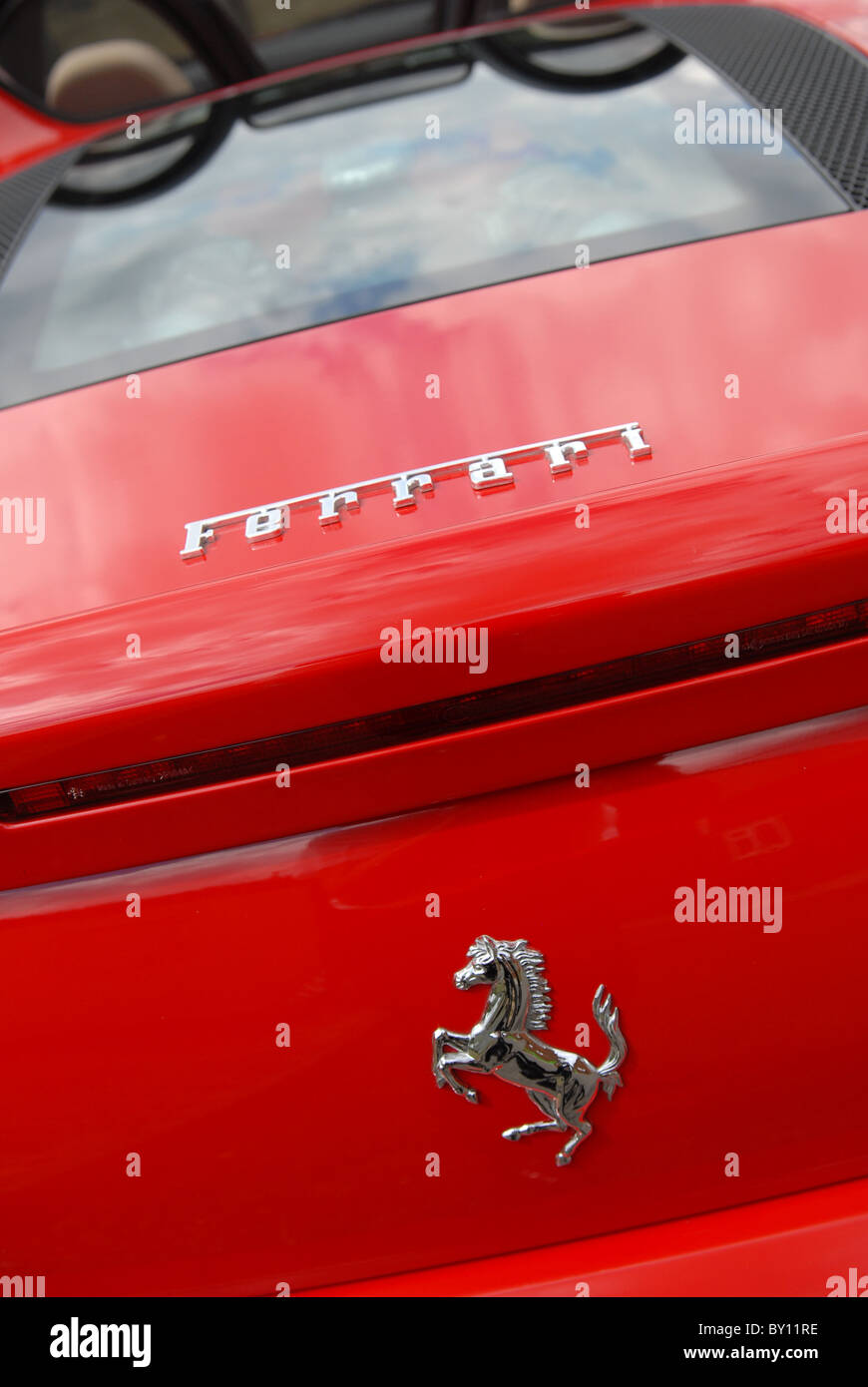 A Red Ferrari detail including logo Stock Photo - Alamy