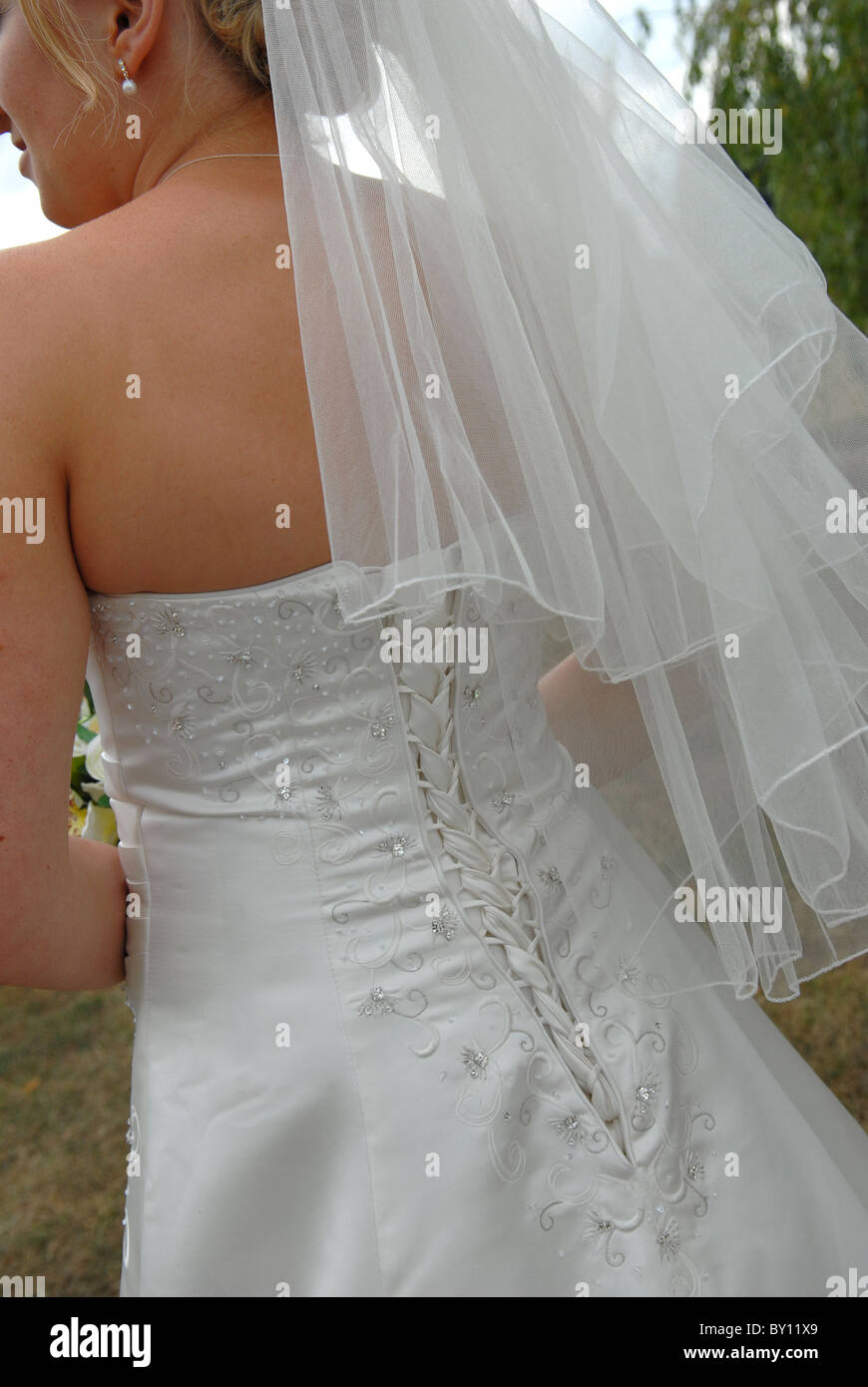 Rear / back view of a wedding a brides wedding dress detail Stock Photo ...