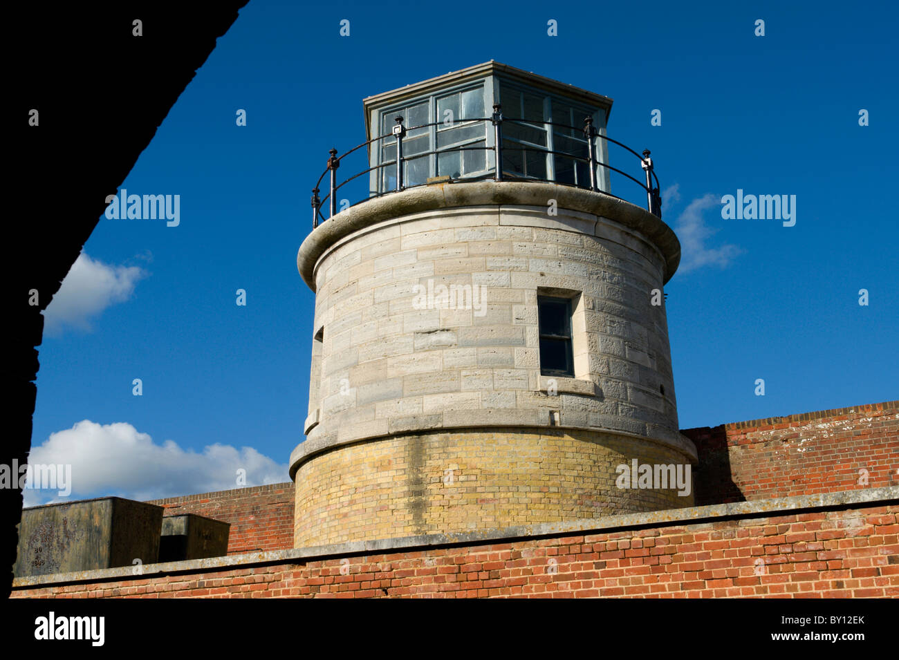 A tower at Hurst Castle near Milford on Sea against a bright blue ...