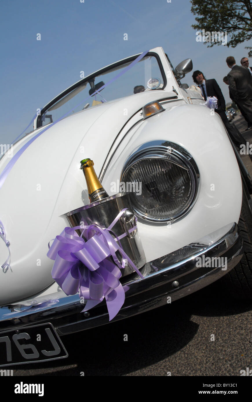 A VW convertable Volkswagen beetle wedding car with Champagne bucket on ...