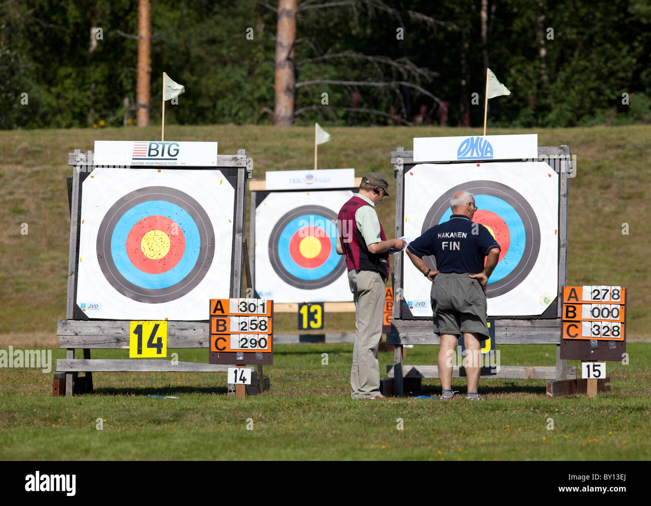 Judges checking the official FITA archery targets in a competition ...