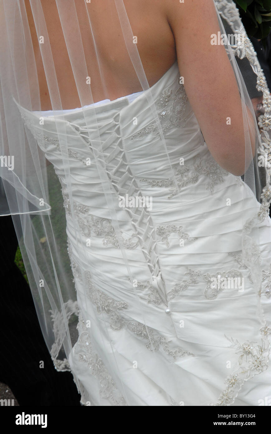 Rear / back view of a wedding a brides wedding dress detail Stock Photo ...