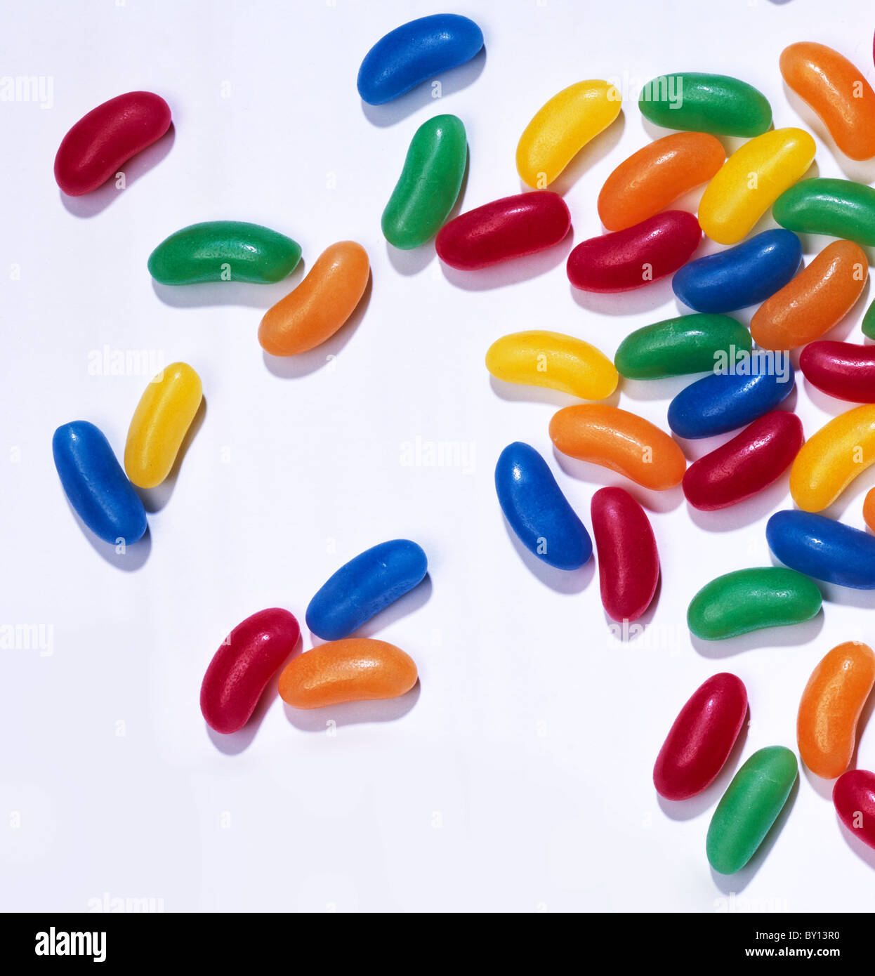 multi coloured colored Jelly beans on white background Stock Photo - Alamy