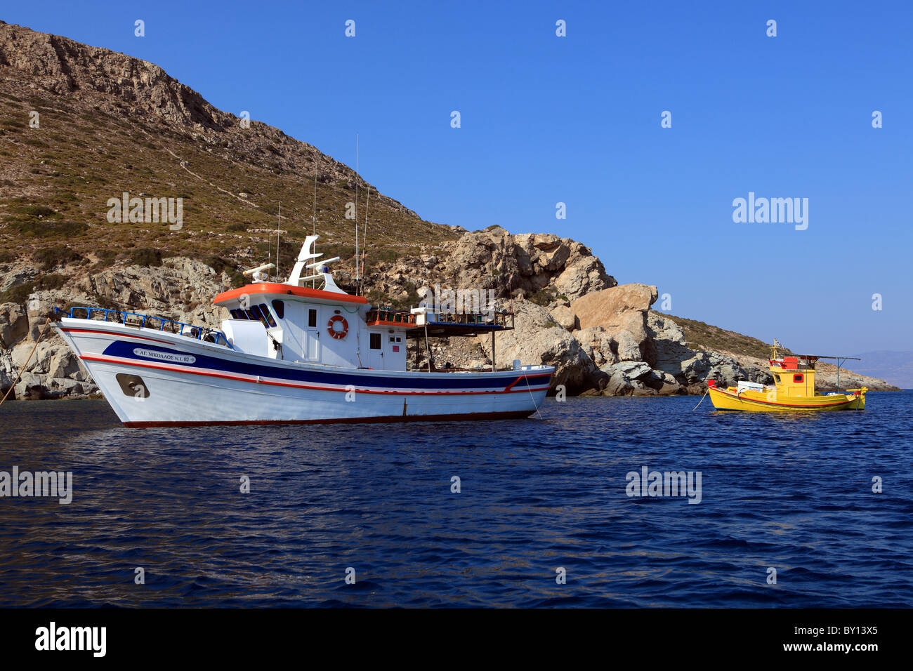 greece cyclades sikinos two fishing boats at anchor Stock Photo - Alamy