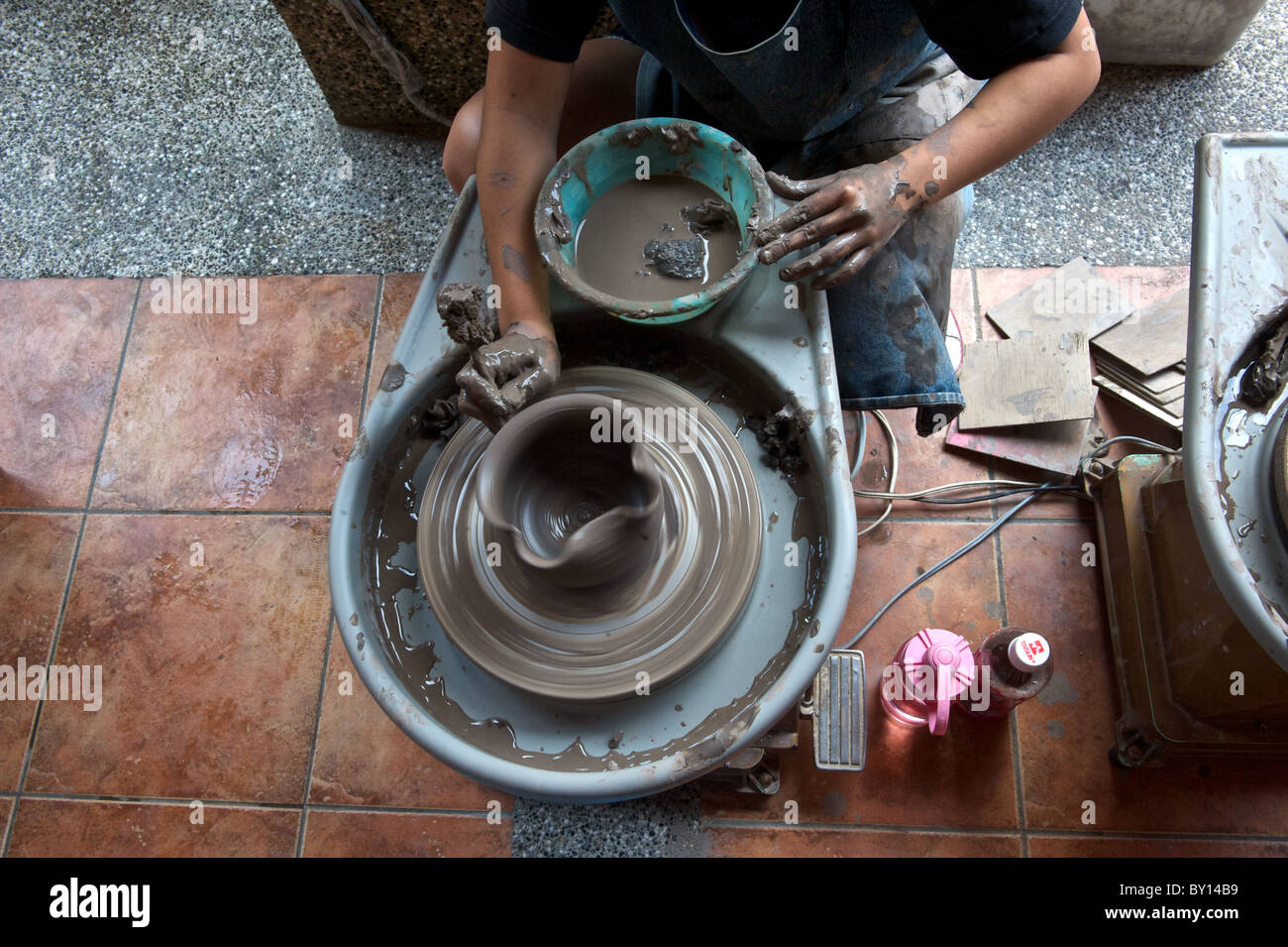 A man working on a pottery wheel in Taipei, Taiwan Stock Photo - Alamy