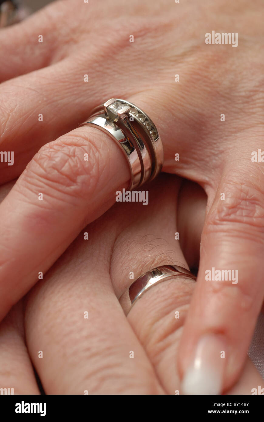 Bride and Grooms wedding rings on their wedding day resting on the ...