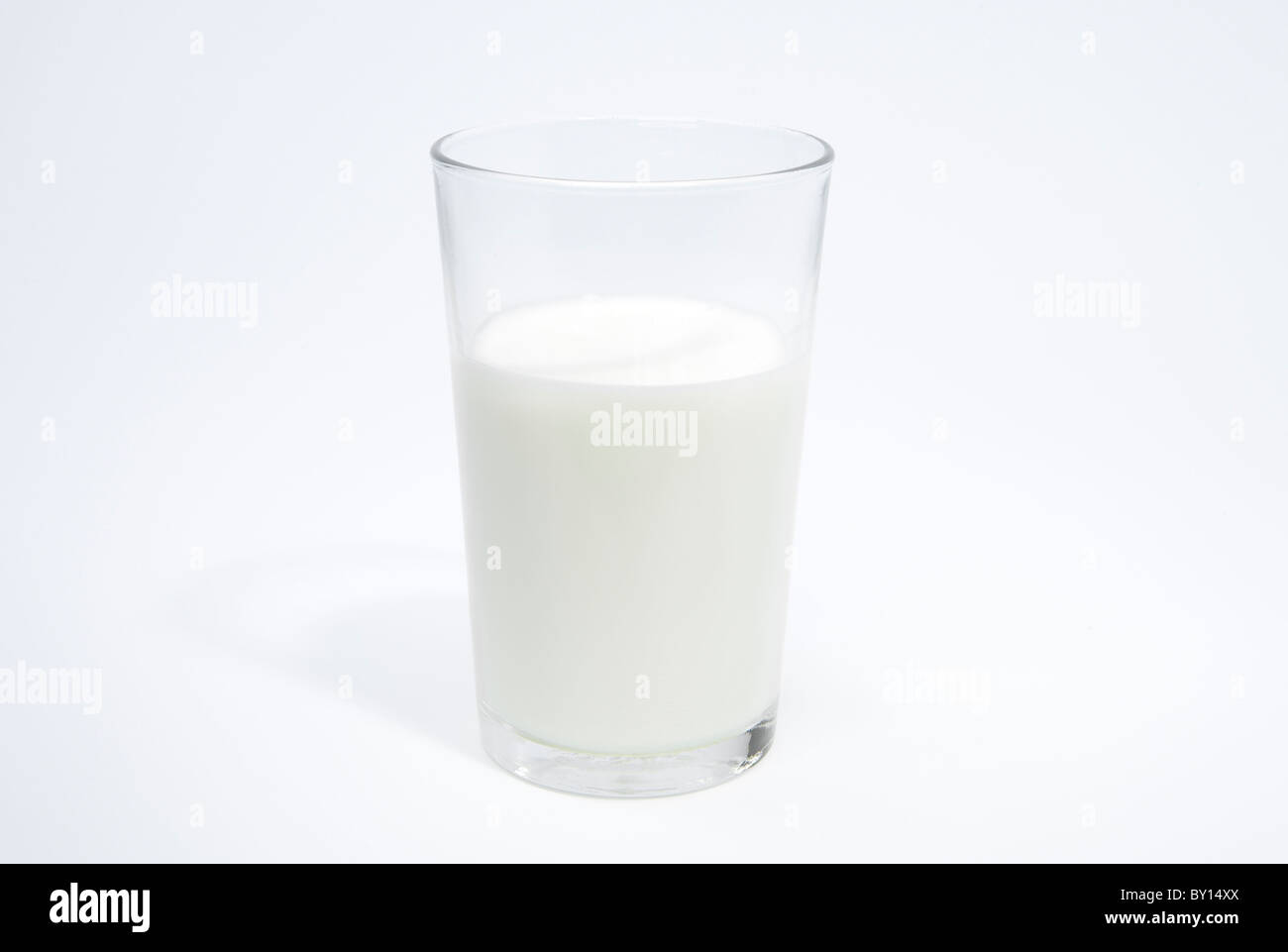 Glass filled with milk Stock Photo - Alamy