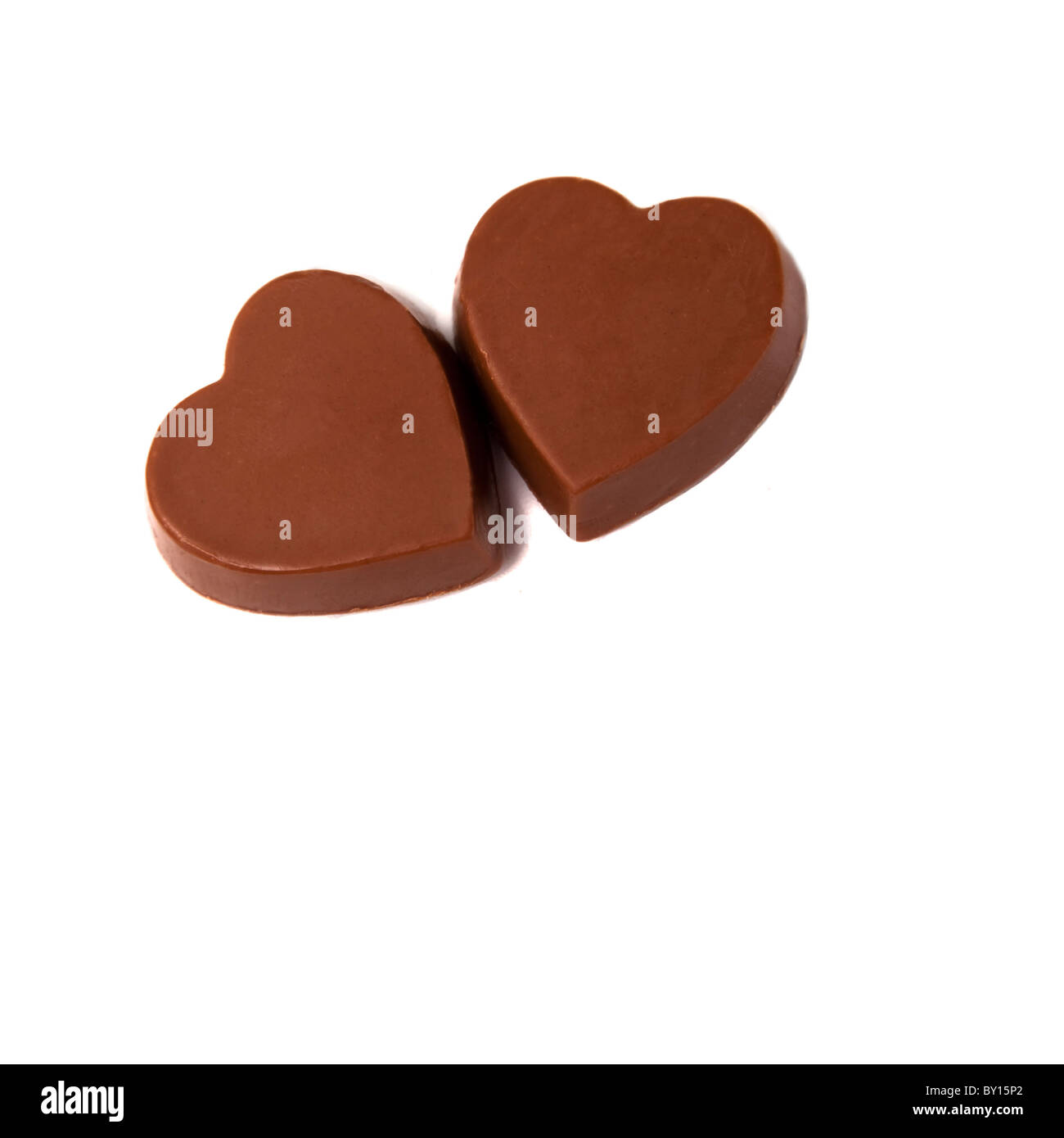 Two chocolate hearts isolated Stock Photo - Alamy