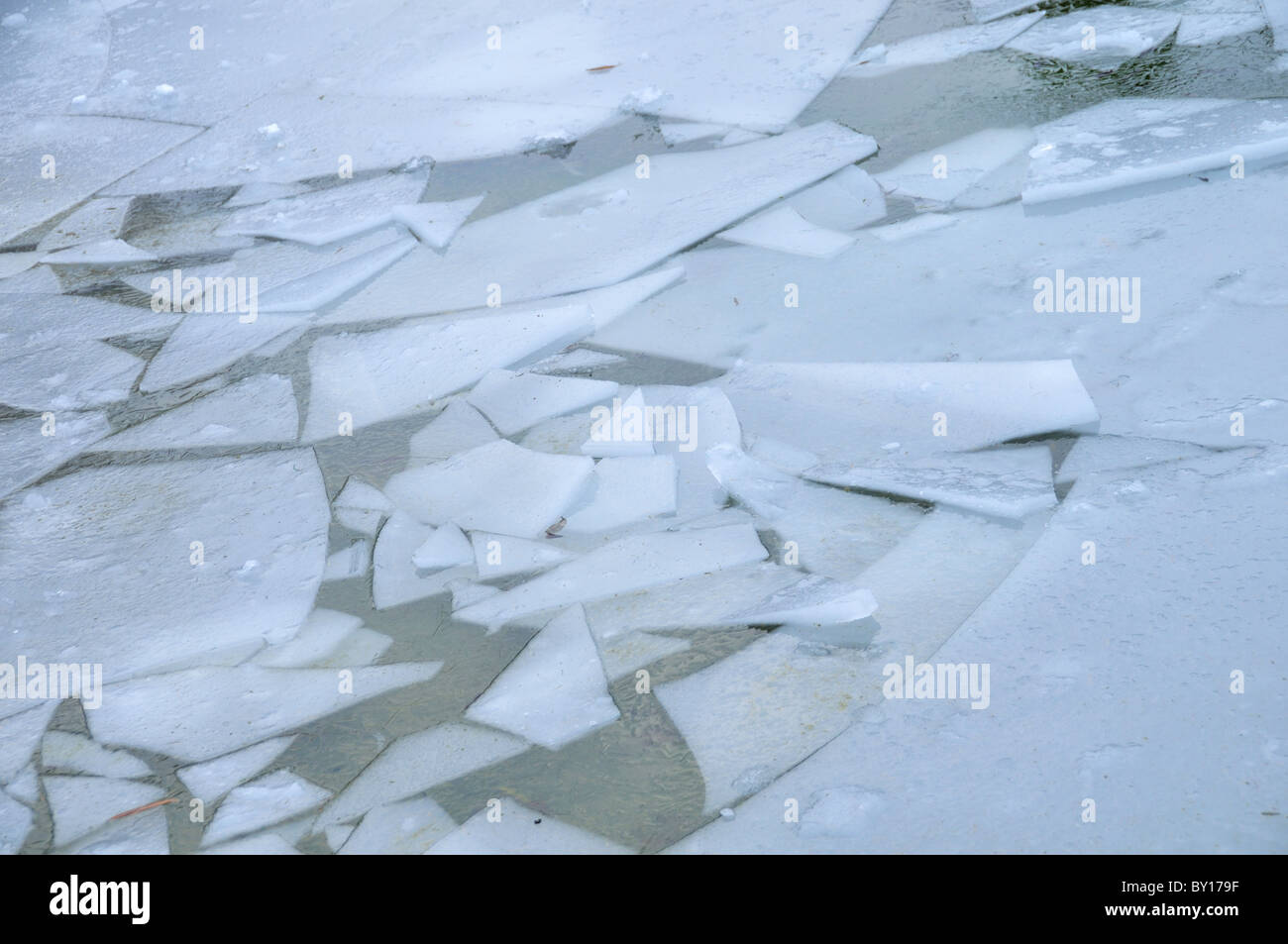 Broken ice on a frozen pond Stock Photo - Alamy