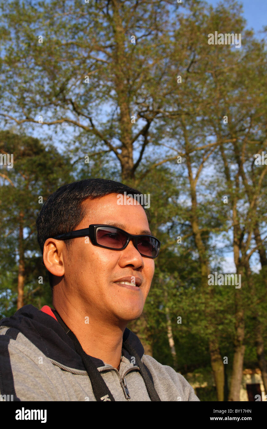 A Thai man at a lake, Skorzecin, Poland Stock Photo - Alamy