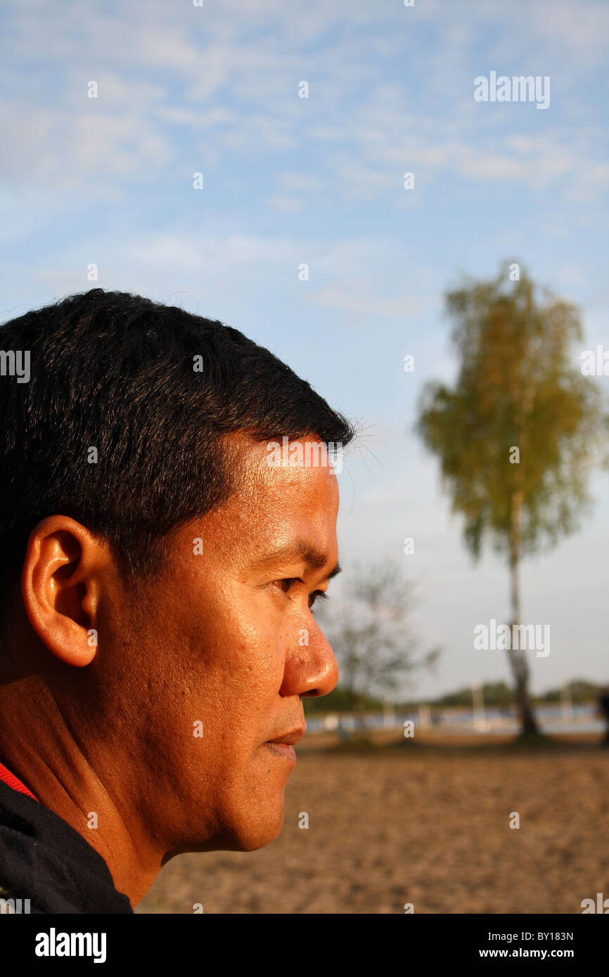 A Thai man at a lake, Skorzecin, Poland Stock Photo - Alamy