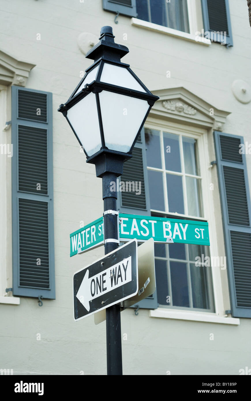 Lamp post with street sign and one way sign in historic district of ...