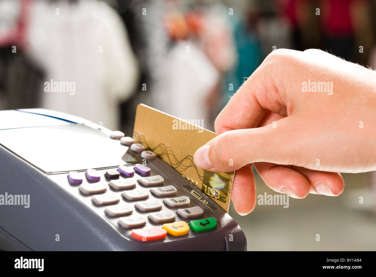 Close-up of human hand holding plastic card in payment machine Stock ...
