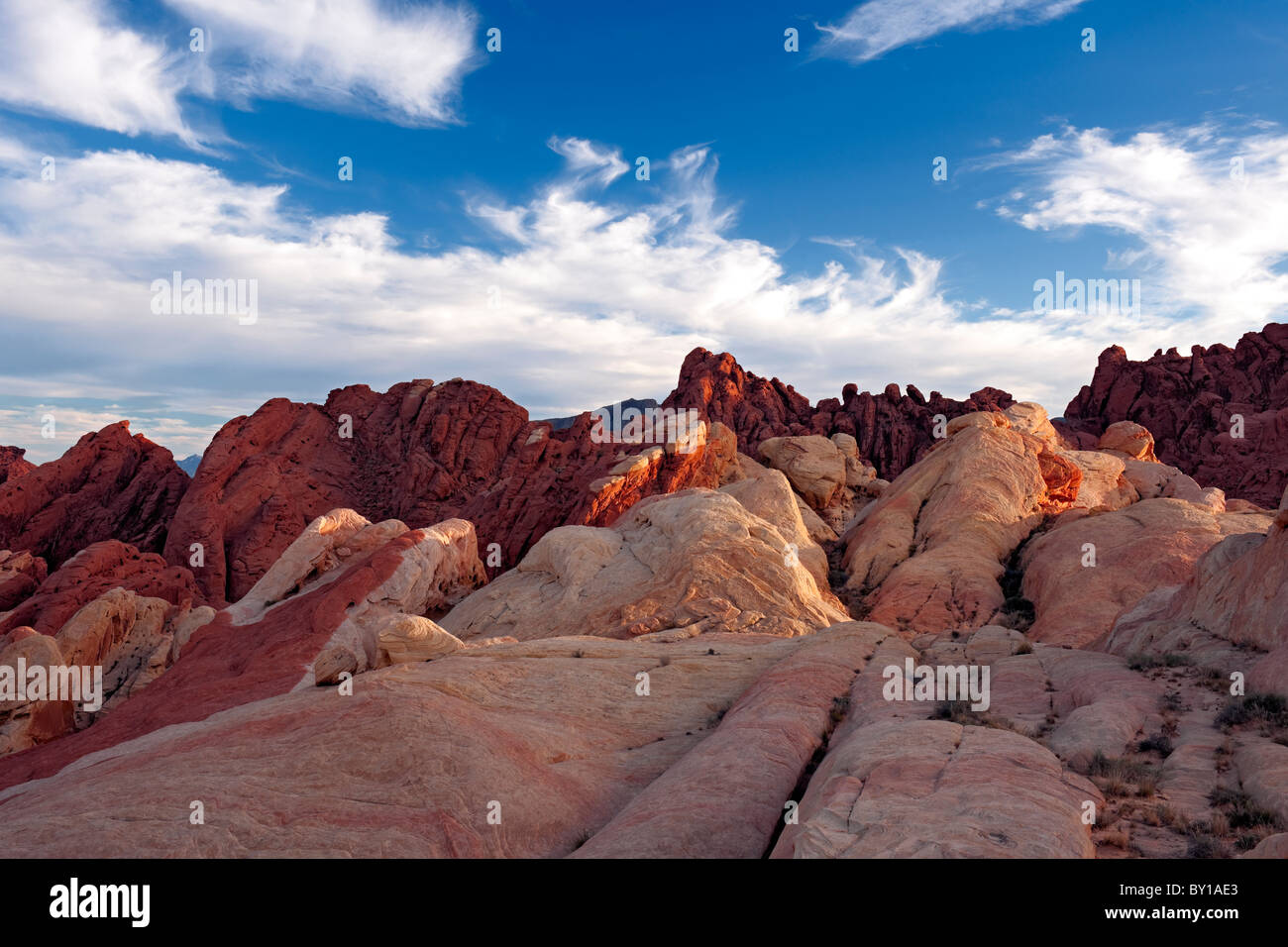 Evening clouds pass over the sandstone landscape of Fire Canyon and ...