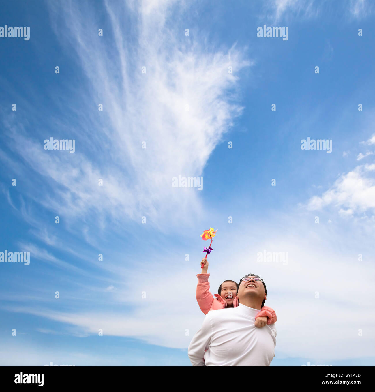 Happy girl and father with cloud and sky background Stock Photo - Alamy
