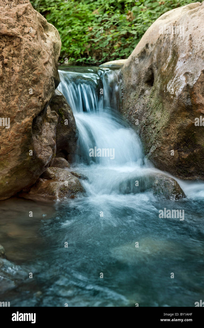 Stream with rocks in motion blur at Kziv river in the Galilee northern ...