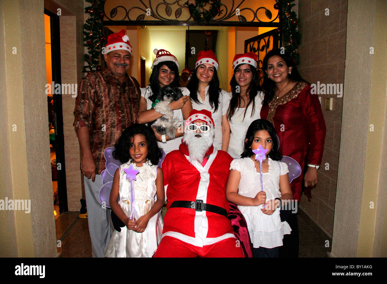 An indian family with a santa clause Stock Photo - Alamy