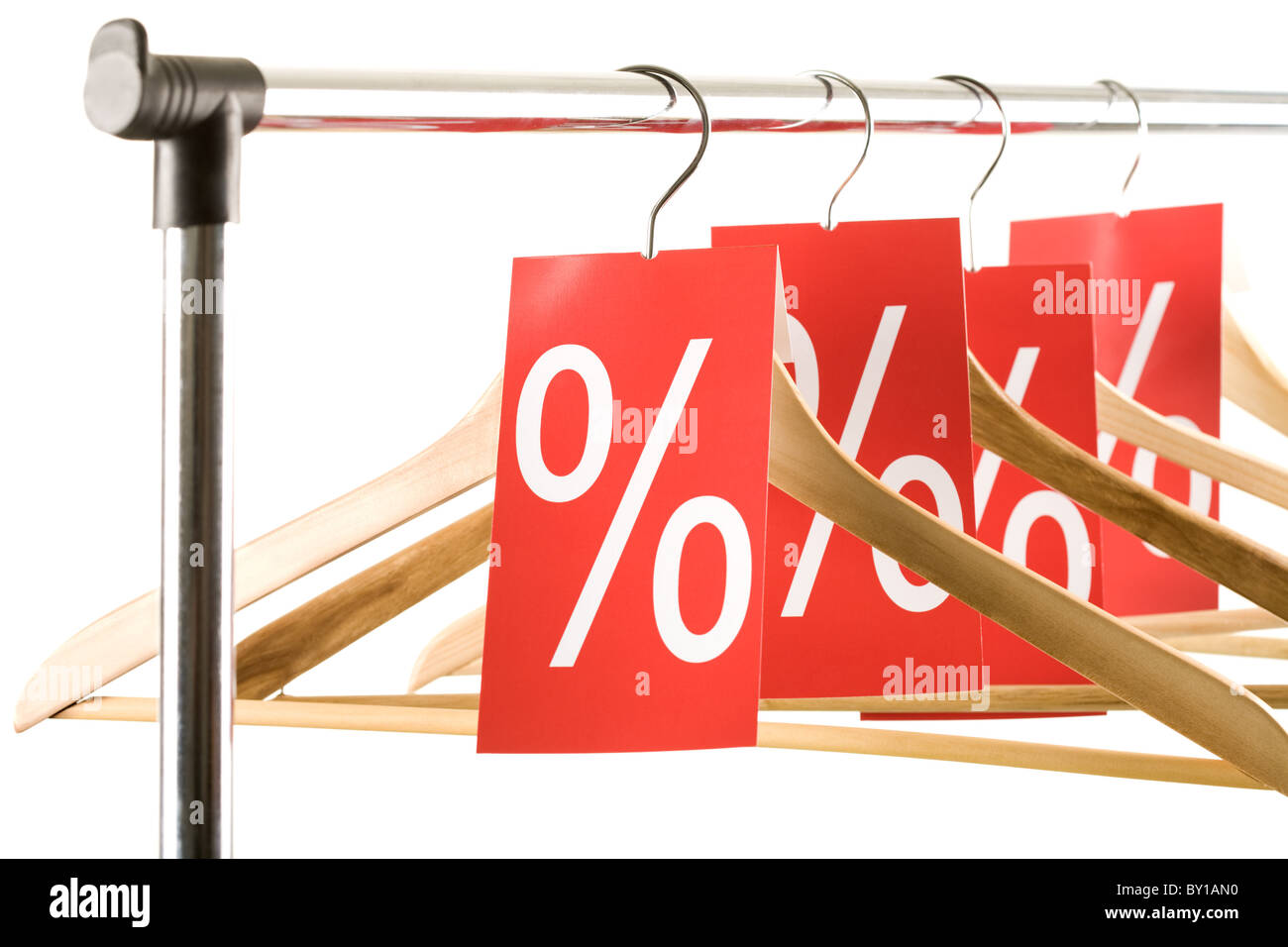 Close-up of hangers with red labels showing percentage in shop Stock ...